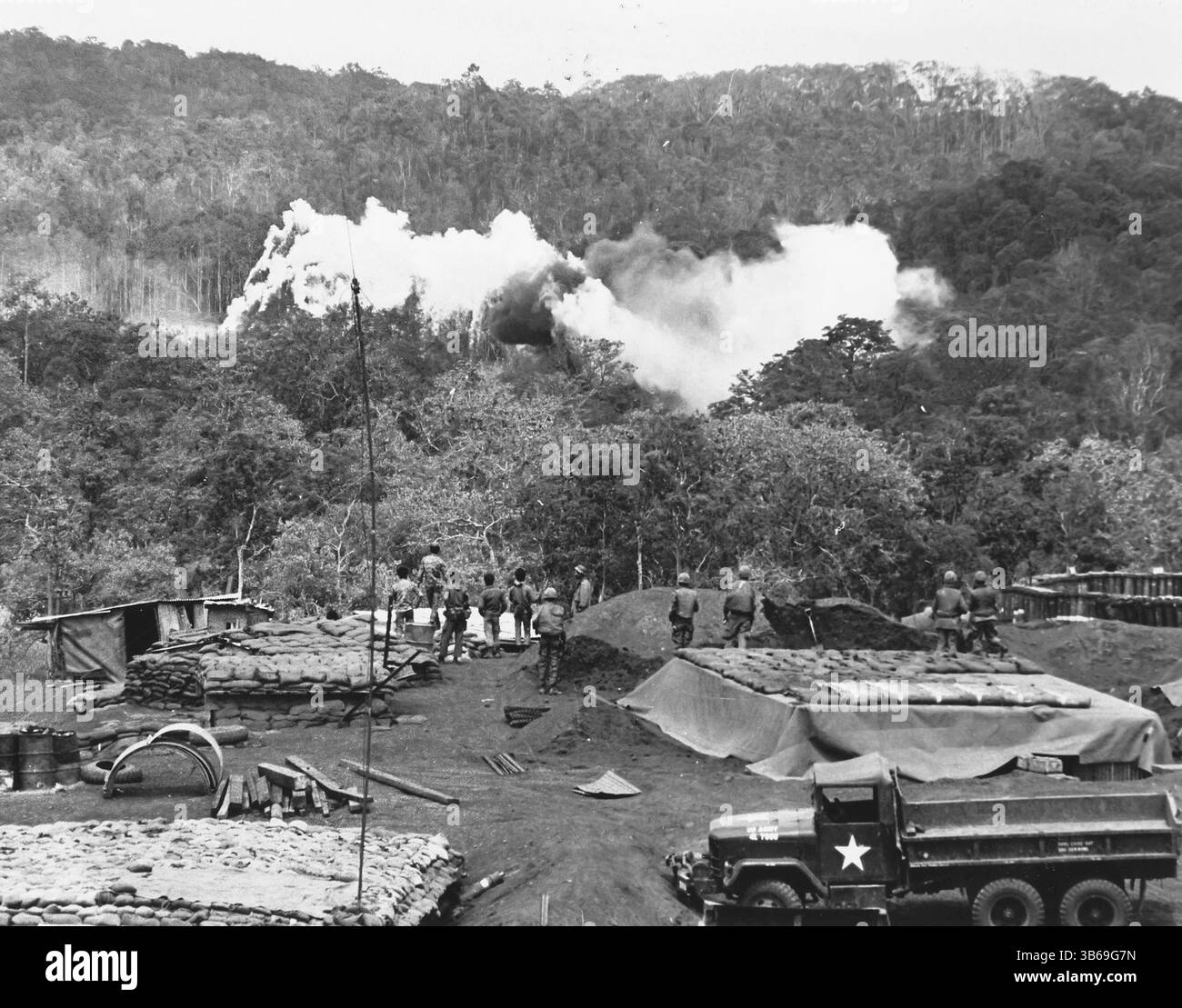 Soldiers watch an air strike just outside the Ben Het Special Forces ...