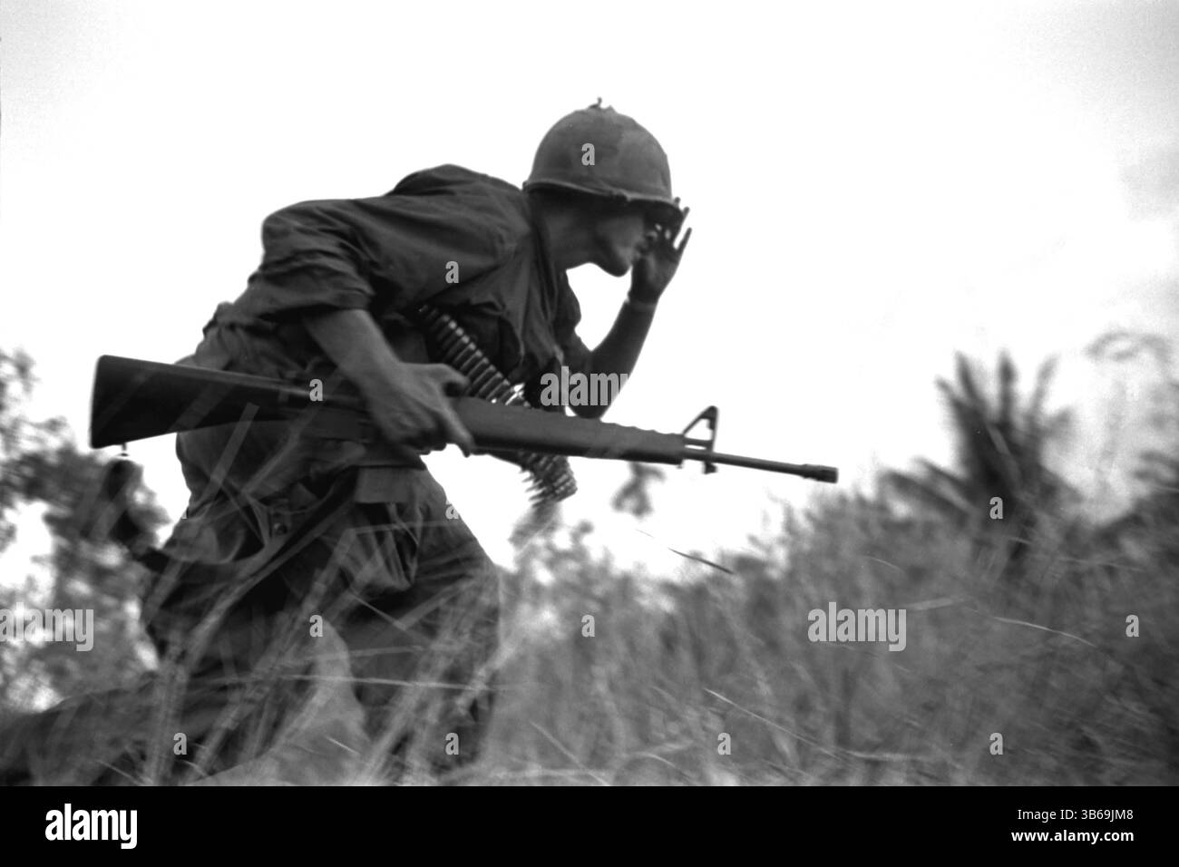 A U.S. Army soldier runs for cover in the Hiep Duc Valley during the ...