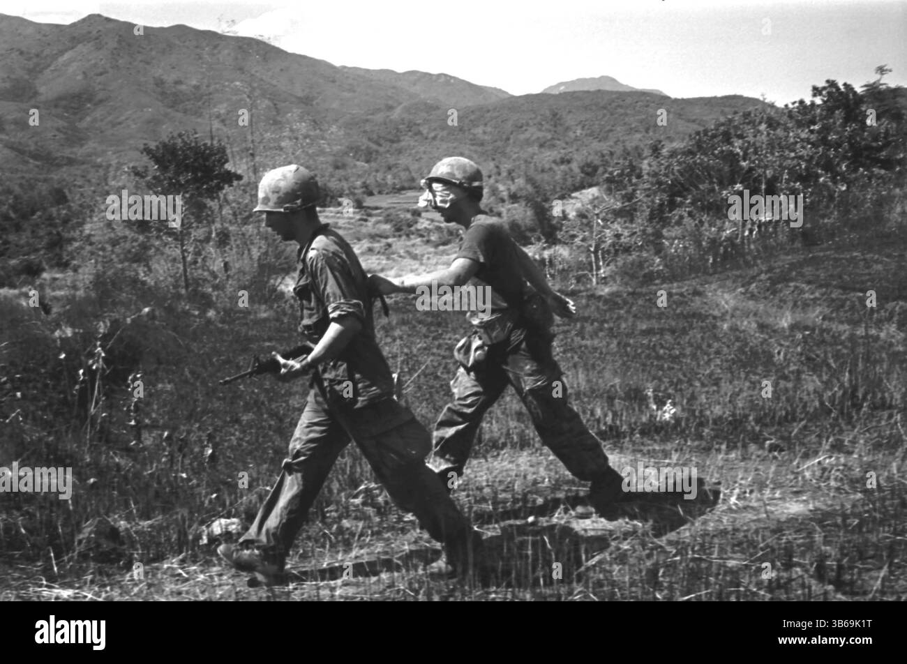 A wounded soldier is led to a medevac helicopter during the Vietnam War ...
