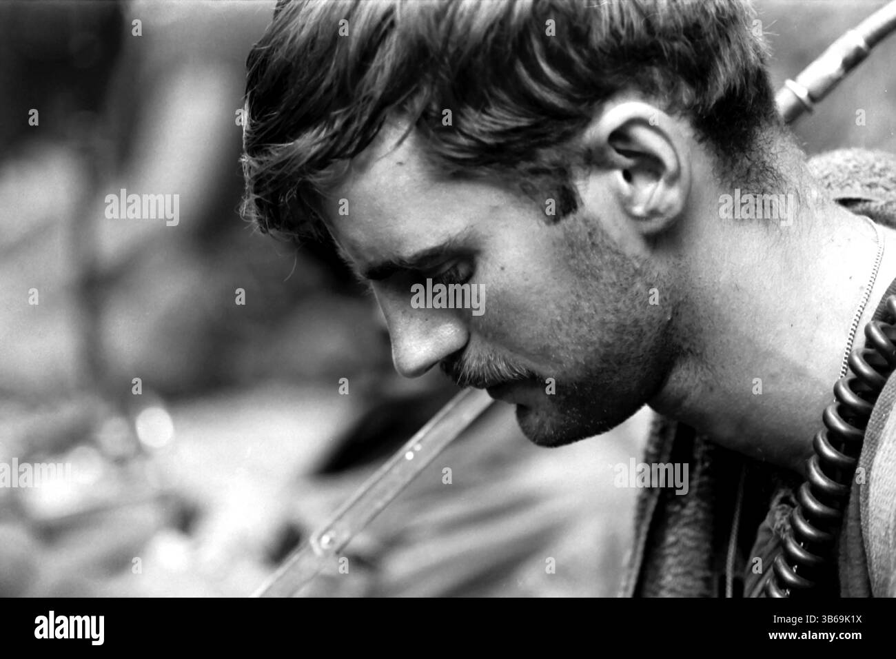A radio operator takes a breather during fighting in the Hiep Duc ...