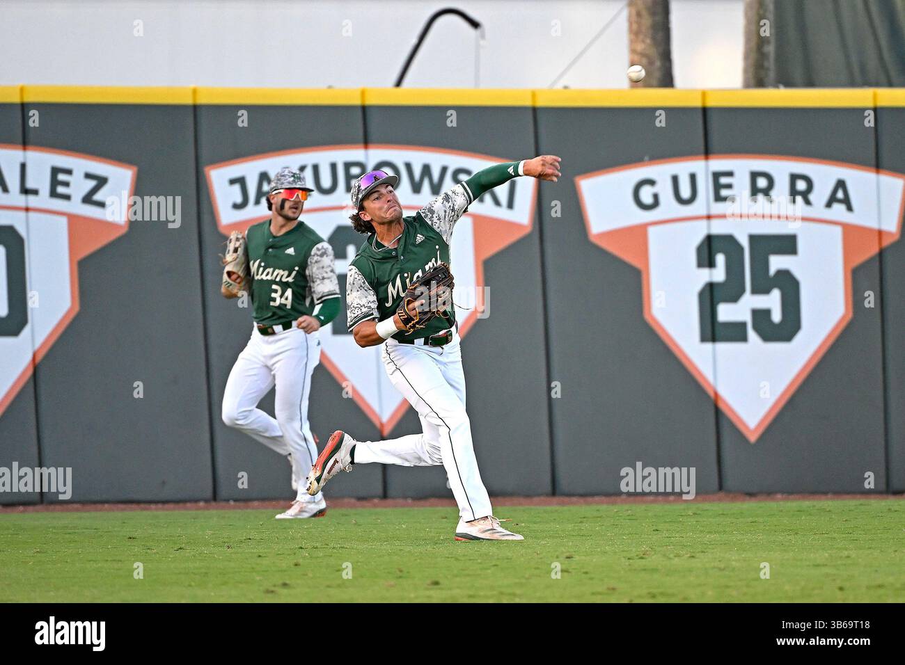 CORAL GABLES, FL - MAY 02: Miami outfielder Max Galvin (7) throws the ...