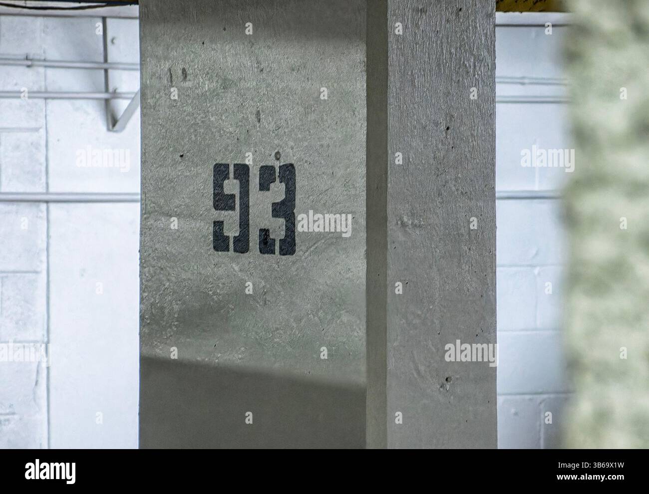 Number 93 on the wall of an underground garage Stock Photo - Alamy