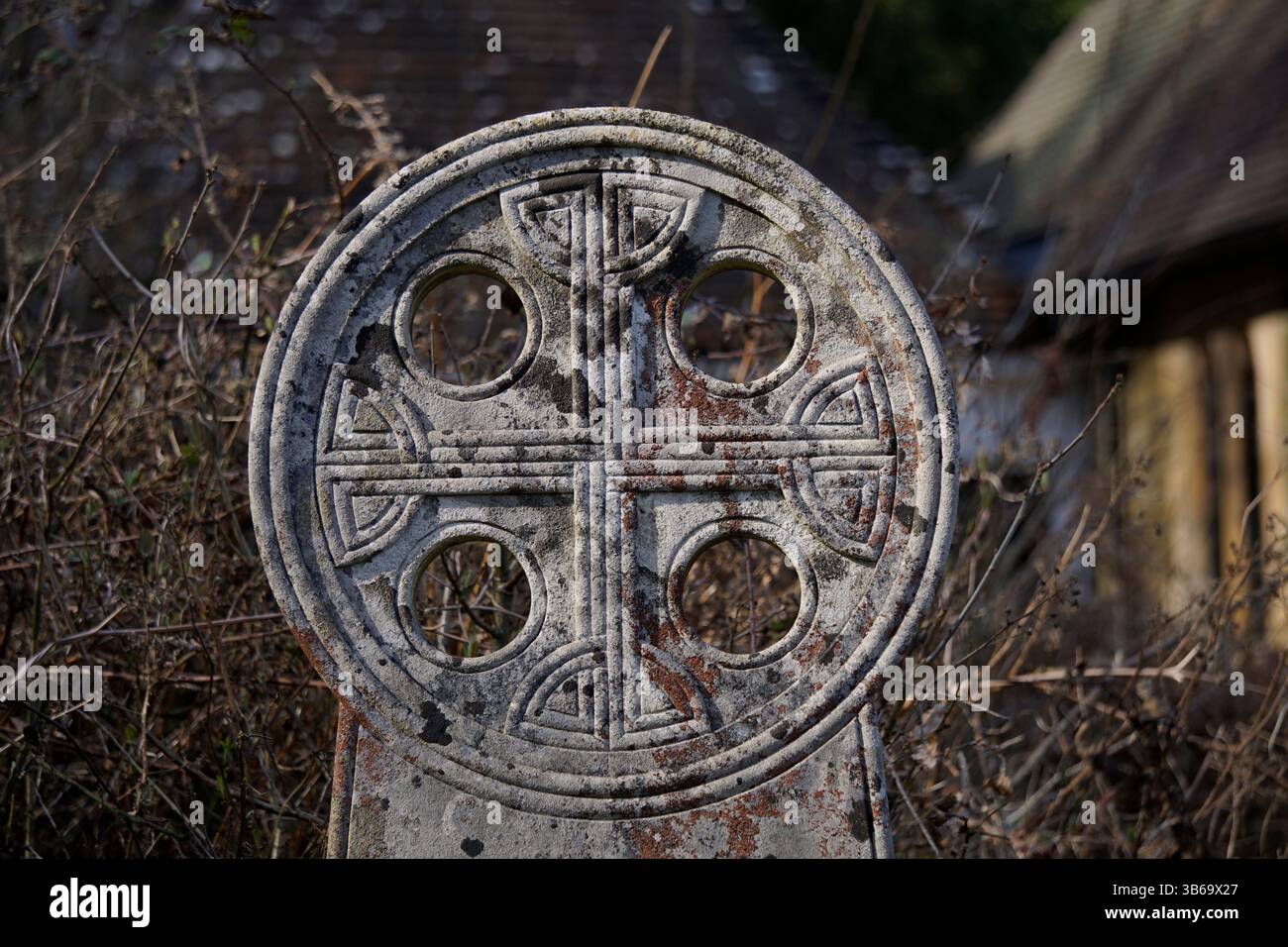 Celtic Cross Gravestone in an Overgrown Cemetery During Dusk with ...