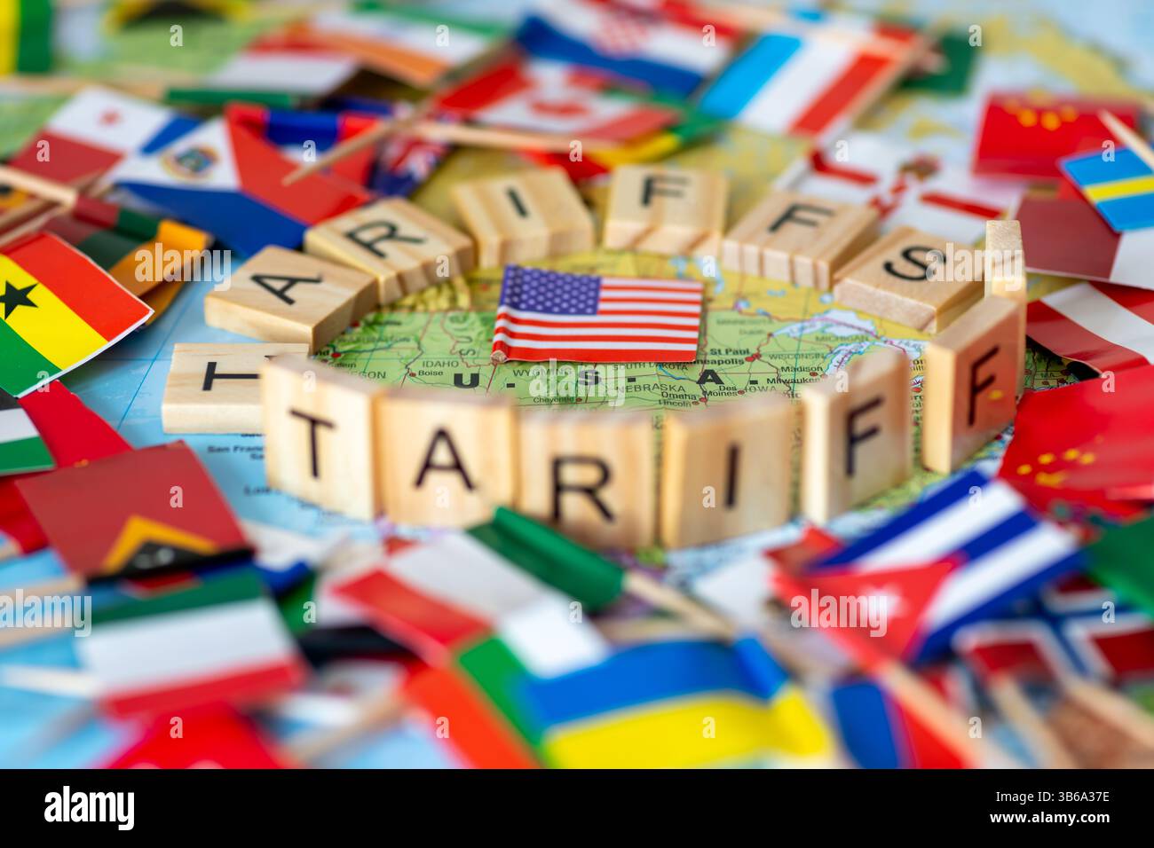 Letter wood tiles forming the words tariffs surrounding a map of the ...
