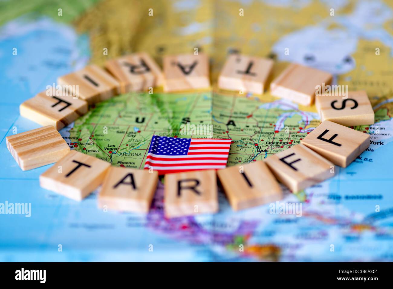 Letter wood tiles forming the words tariffs surrounding a map of the ...
