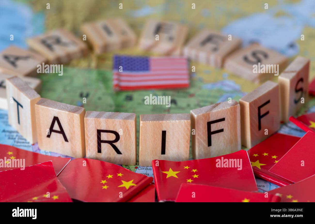 Letter wood tiles forming the words tariffs surrounding a map of the ...