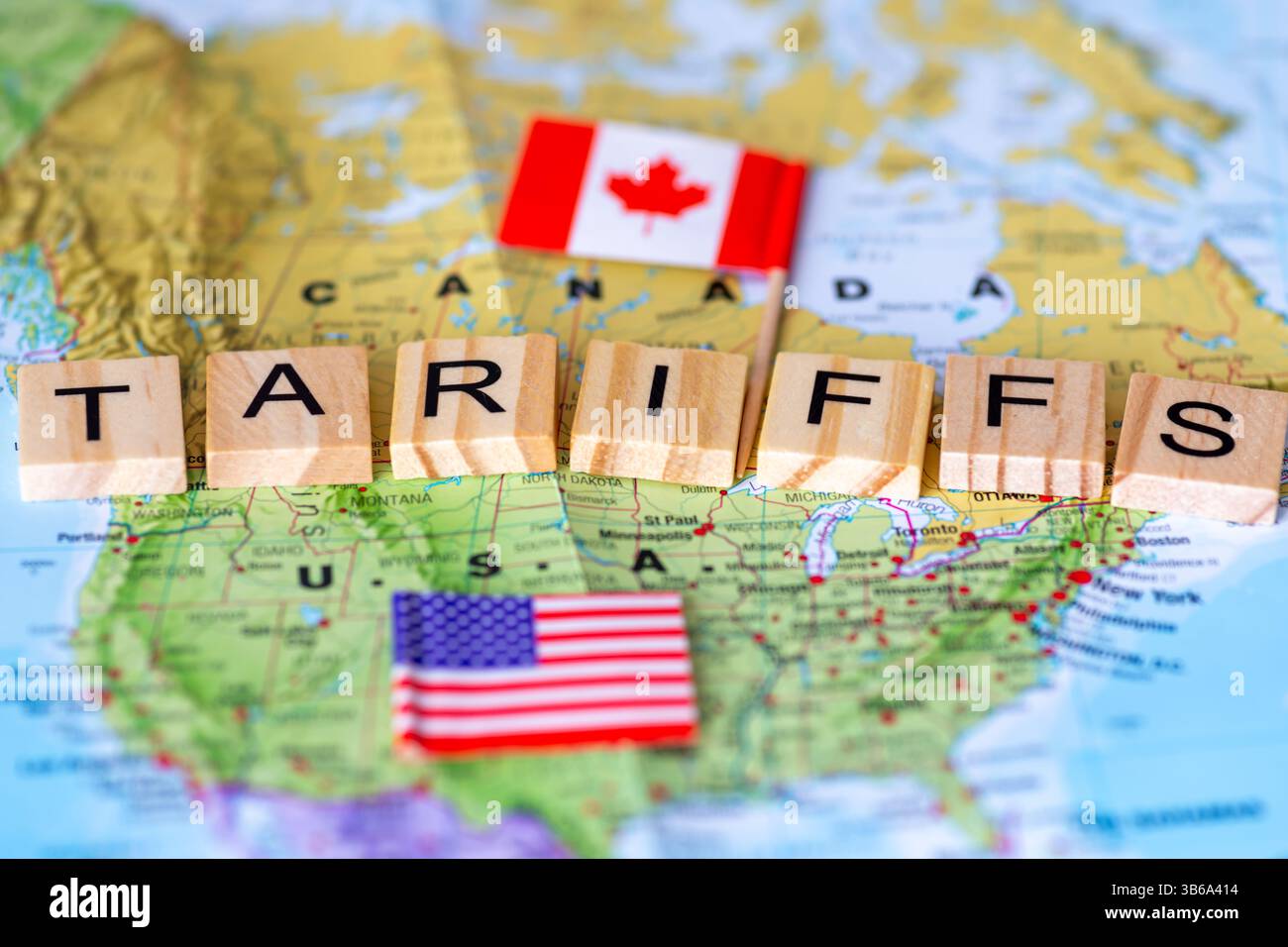 A map of the USA, Canada and national flags, with letter wood tiles ...