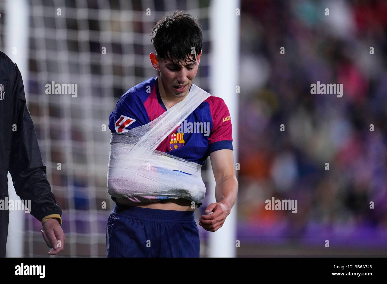 Barcelona's Dani Rodriguez leaves the pitch after an injury during the Spanish La Liga soccer ...