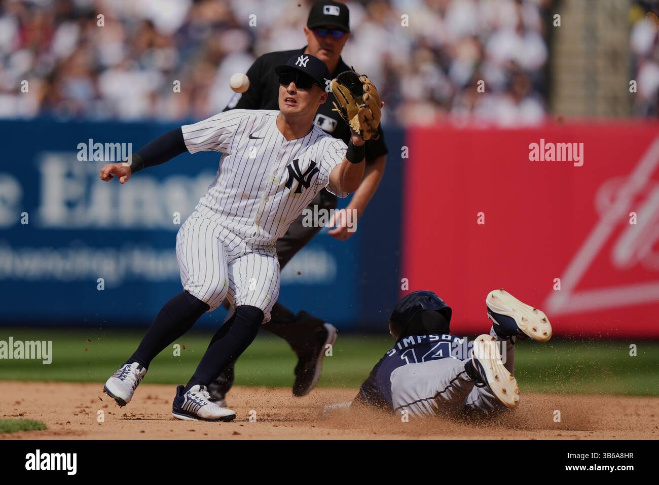 Tampa Bay Rays' Chandler Simpson, right, slides past New York Yankees ...