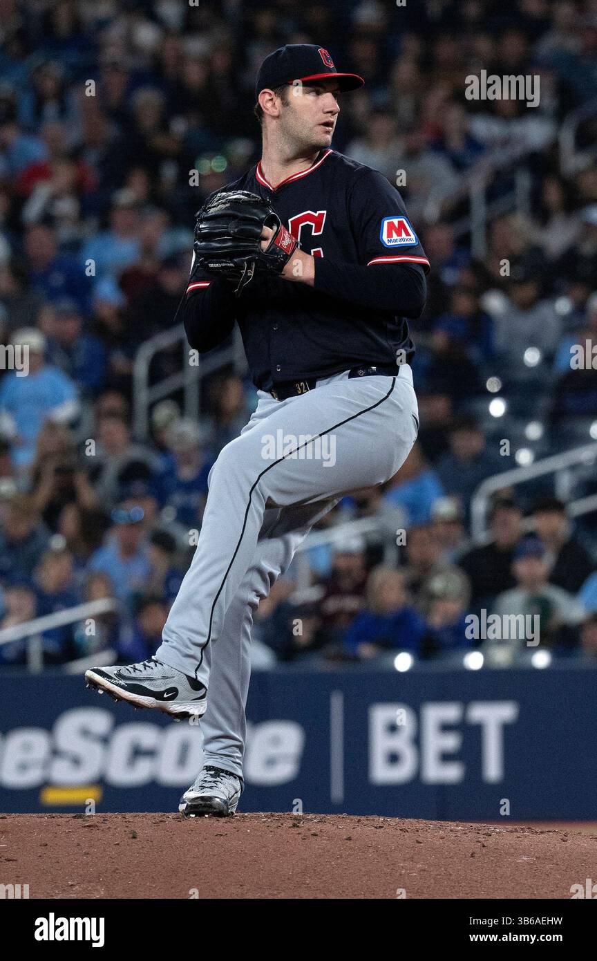 Cleveland Guardians starting pitcher Gavin Williams (32) throws to a ...