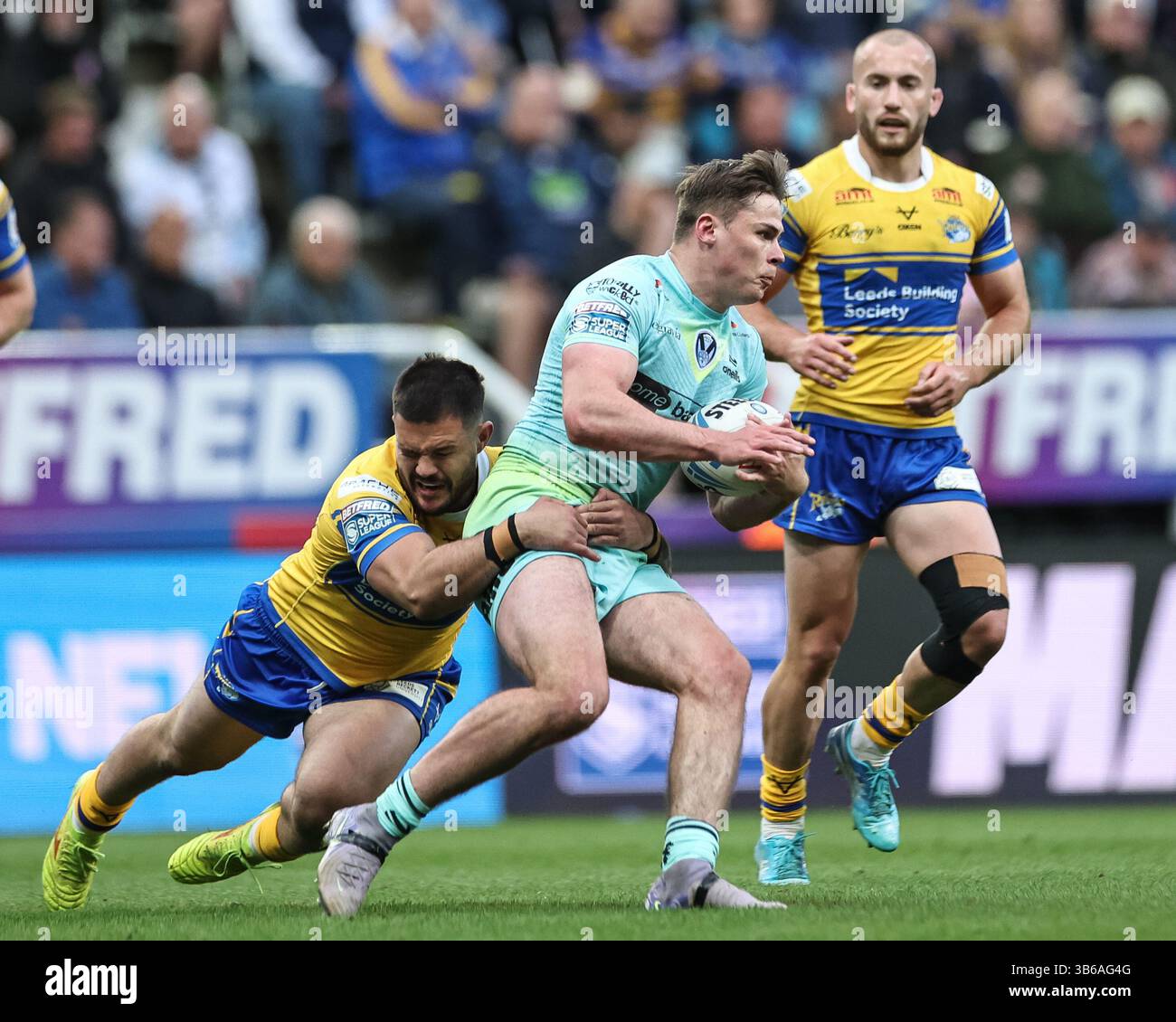 Newcastle, UK. 03rd May, 2025. Jack Welsby of St. Helens is tackled by ...