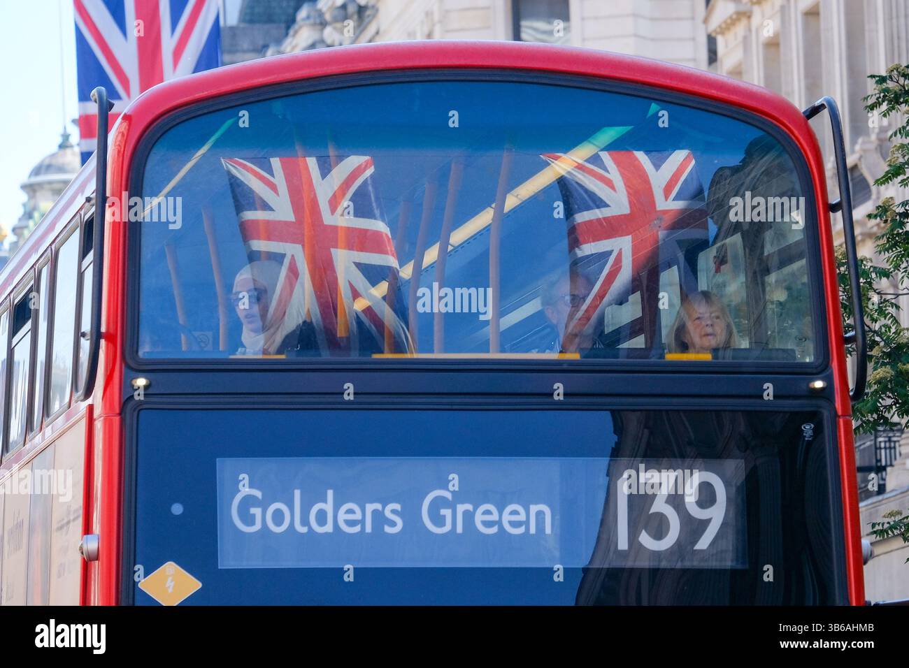 London, UK. 3rd May, 2025. Reflections of Union flags in the front bus ...