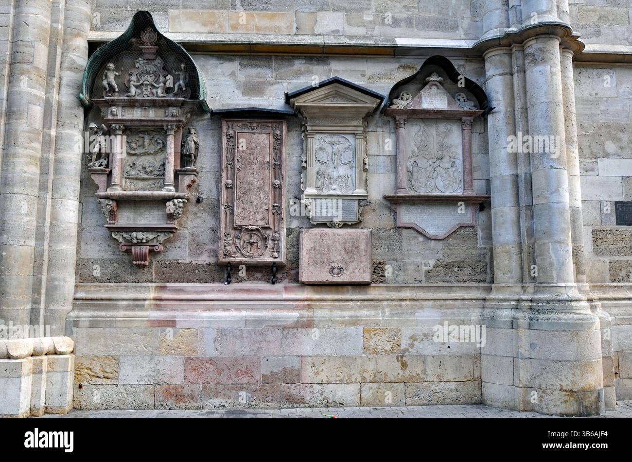 Historic artifacts mounted on an exterior wall of St. Stephen's ...