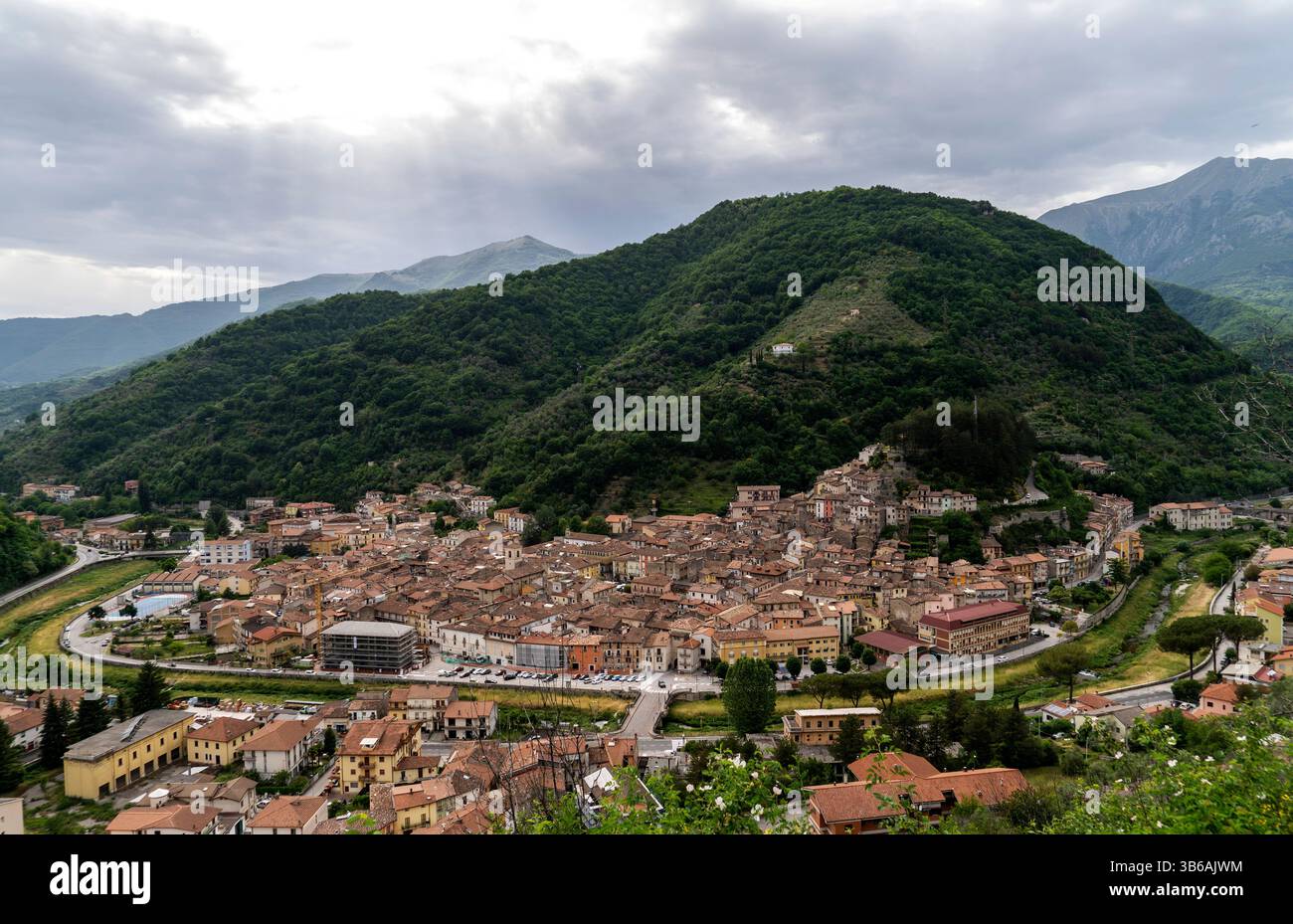 A panoramic view of a quaint Italian village nestled in a valley ...