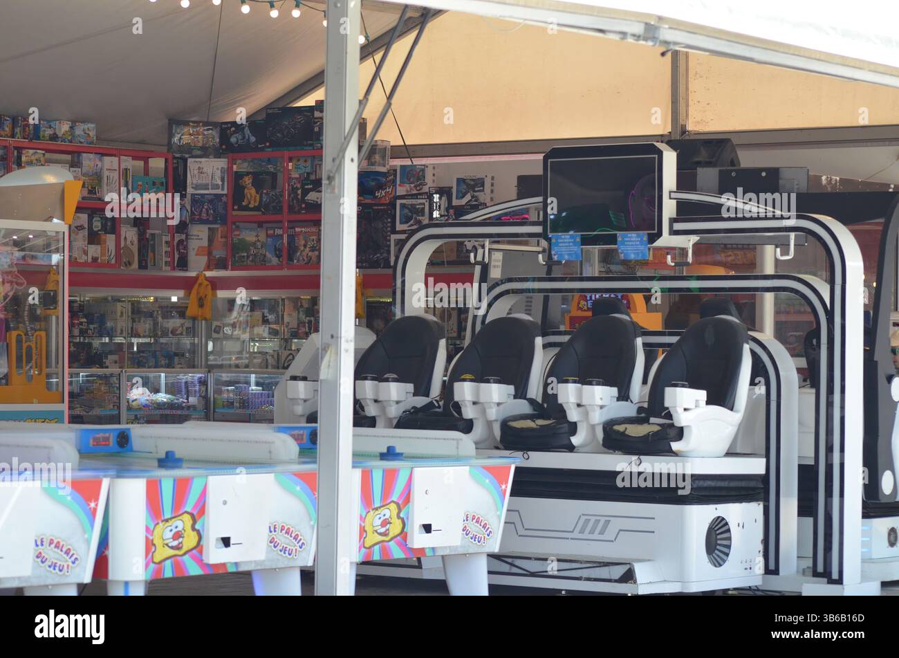 Modern arcade gaming setup featuring sleek white gaming chairs and ...