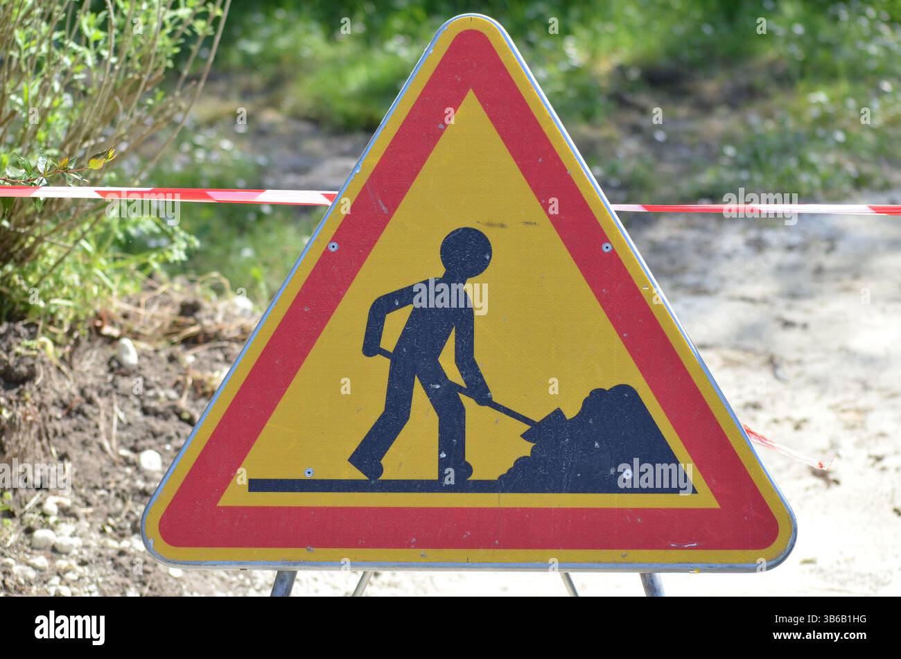 Yellow construction sign featuring black hi-res stock photography and ...