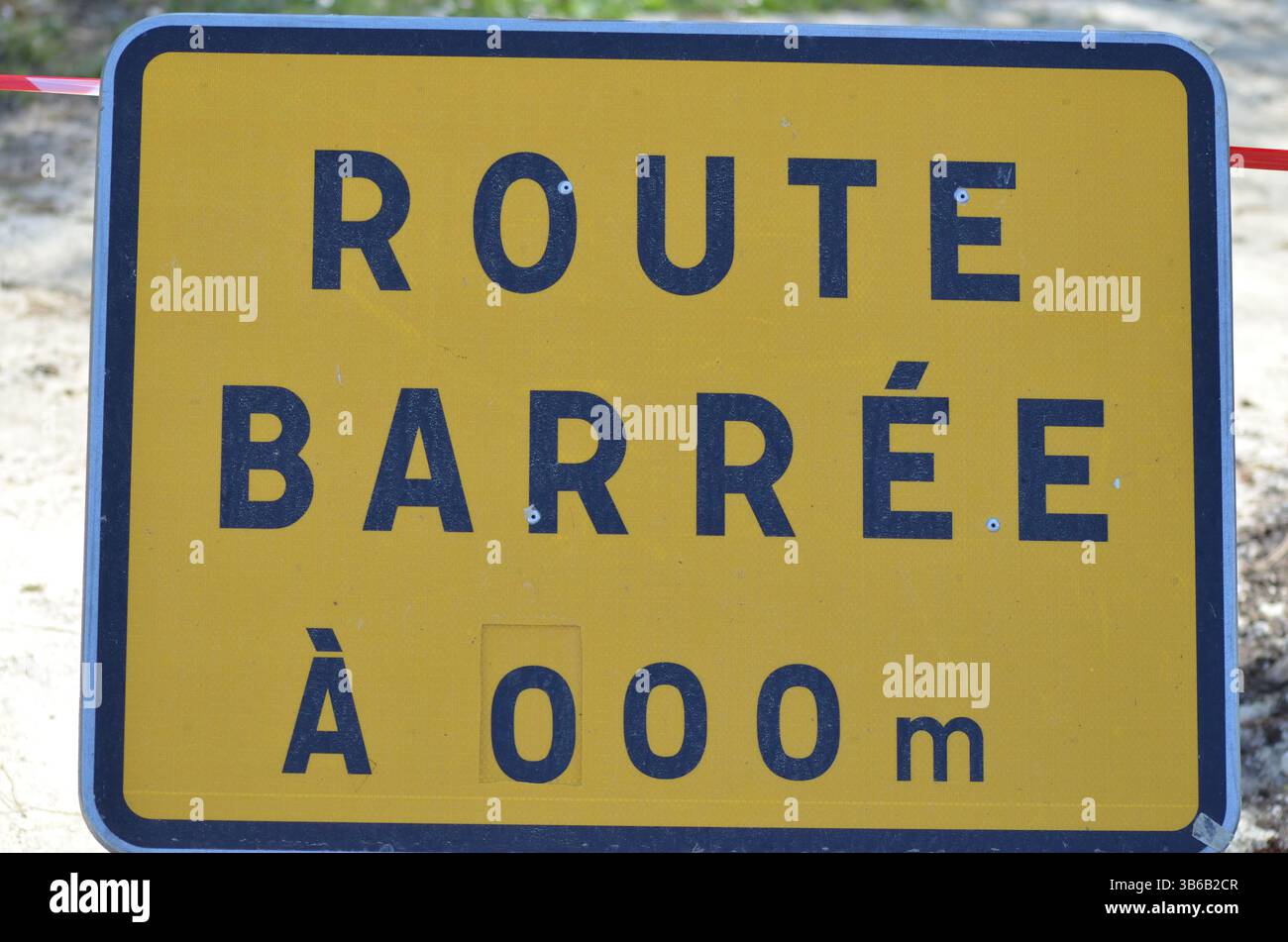 Road closure sign in French indicating detour ahead, featuring bold ...