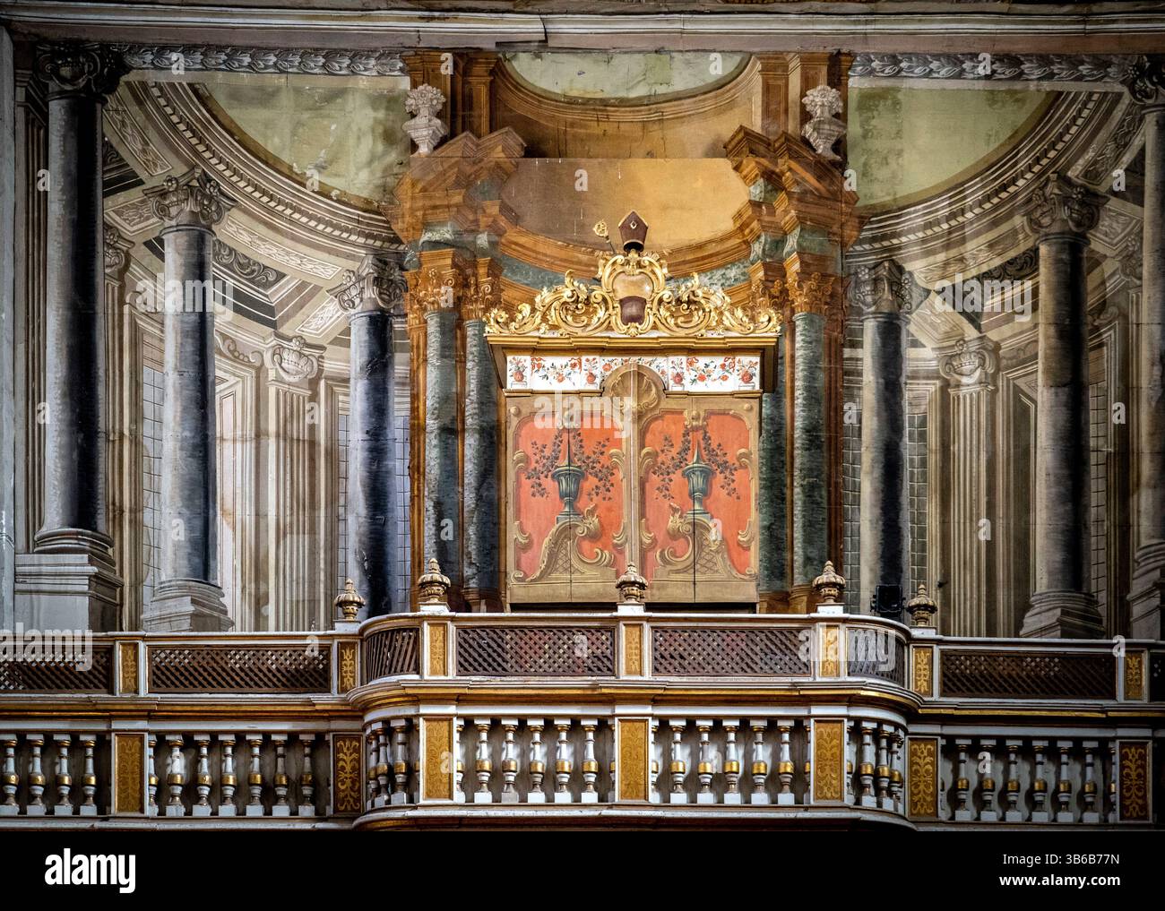 A grand architectural interior featuring ornate columns, a beautifully ...