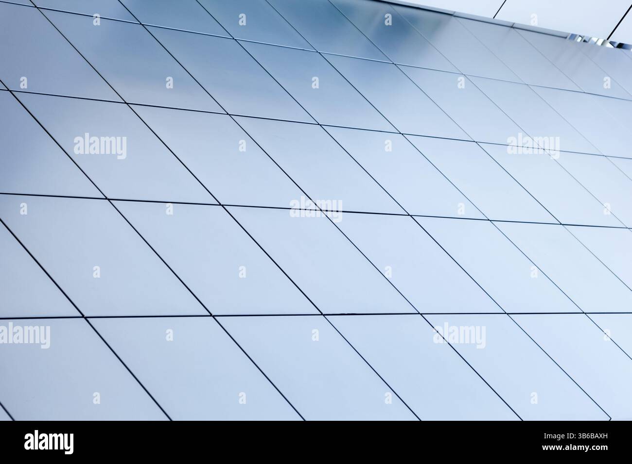 A view of metal reflective squares shown at an angle, as a background ...