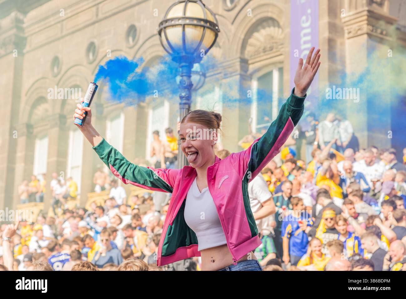 Leeds, UK. 03 MAY, 2025. Girl holds a flare as Leeds United fans ...