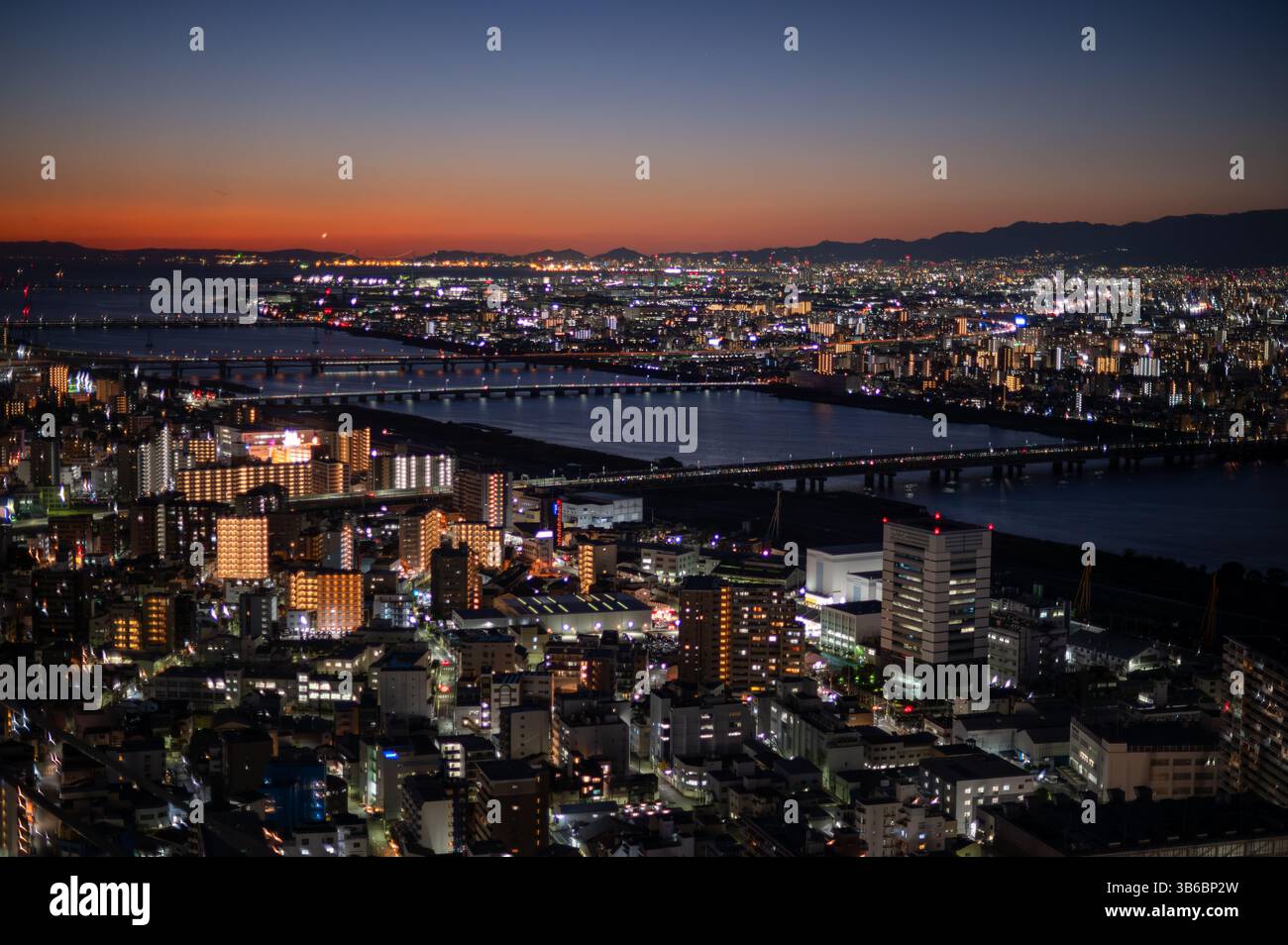 Stunning night view of Osaka city skyline with illuminated buildings ...