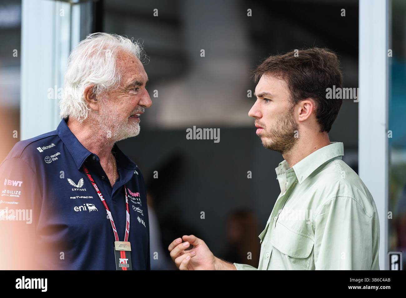 MIAMI, FLORIDA - MAY 3: Flavio Briatore talks with Pierre Gasly of France and BWT Alpine F1 Team ...