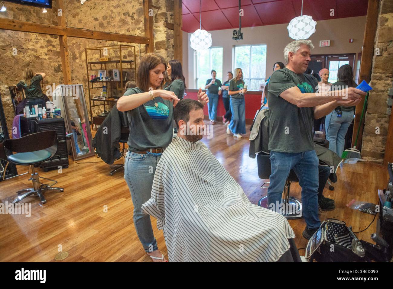 Kara Antenucci of Gravity Salon snips Randy Dickson of Delco who was ...