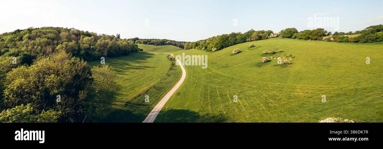 Aerial perspective of a winding country path meandering through vibrant ...