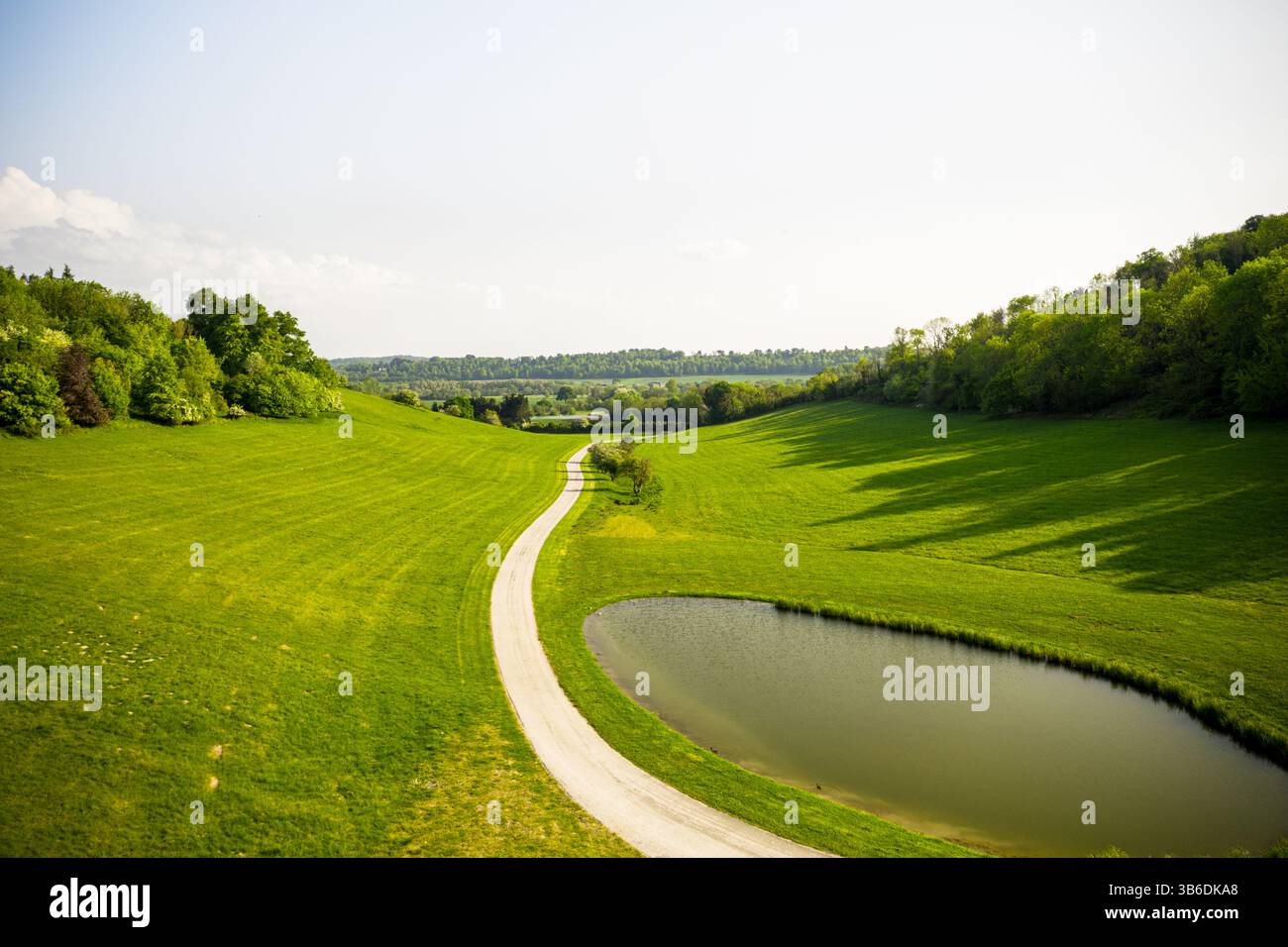 Aerial perspective of a winding country path meandering through vibrant ...