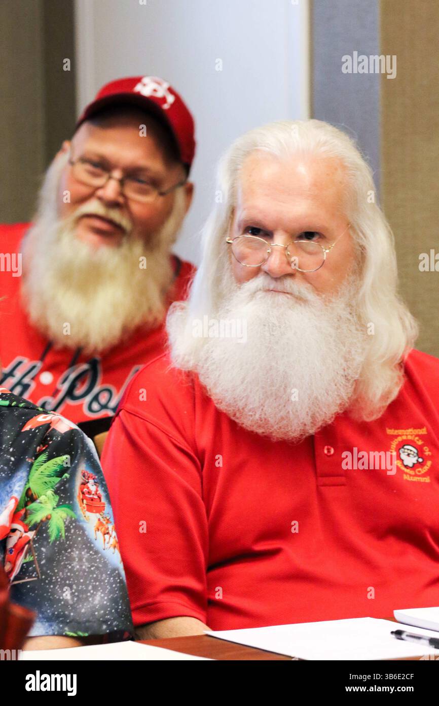 A group of Santas and Mrs. Clauses attend the International University ...