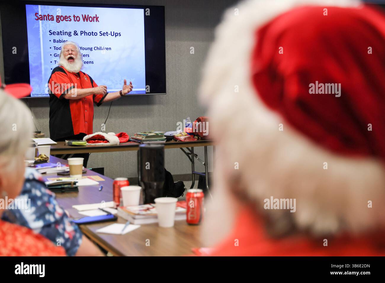 Instructor National Santa Tim Connaghan shows the Santa and Mrs ...