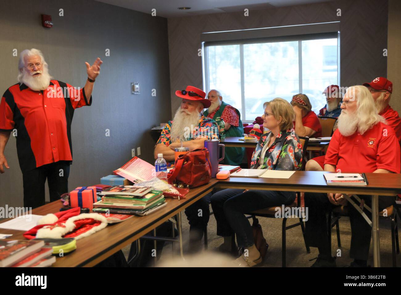 A group of Santas and Mrs. Clauses attend the International University ...