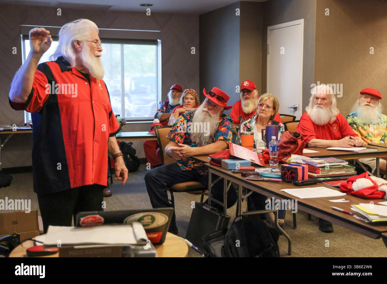 A group of Santas and Mrs. Clauses attend the International University ...