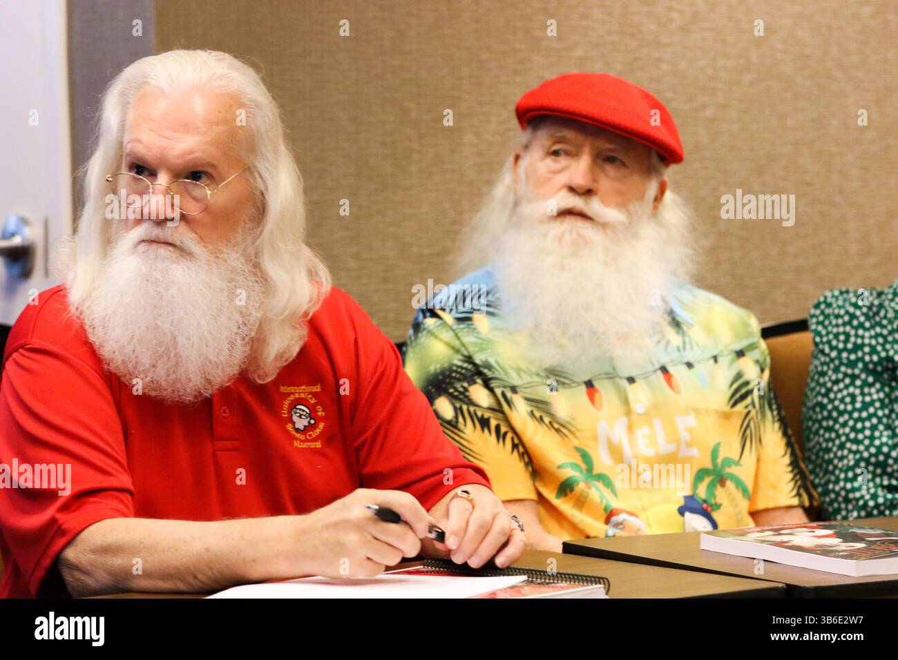 A group of Santas and Mrs. Clauses attend the International University ...