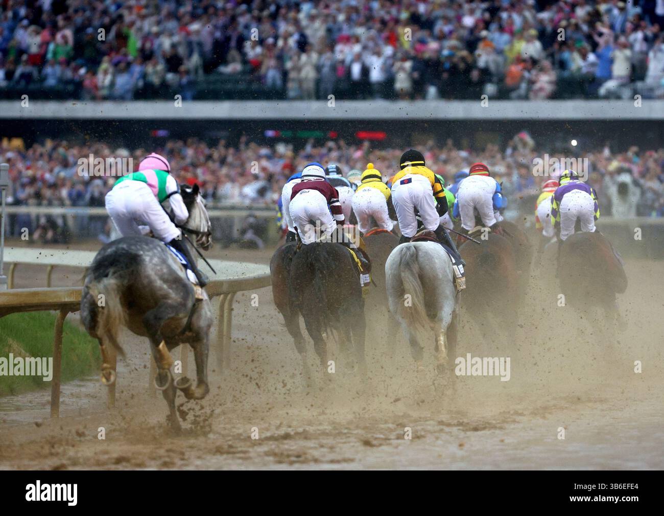 Louisville, United States. 03rd May, 2025. Horses and jockeys race into ...