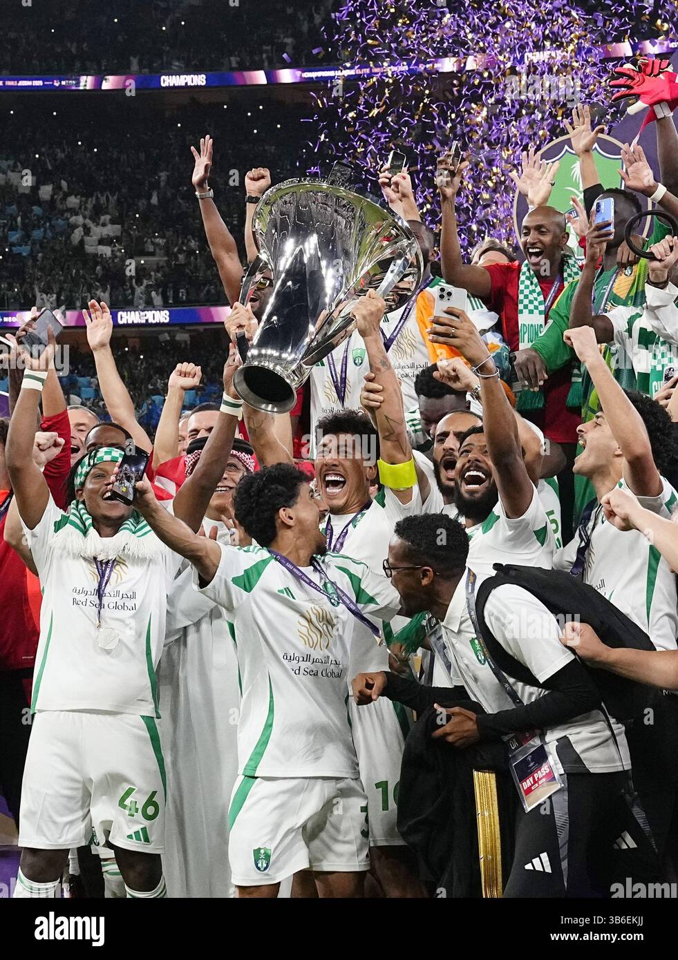 Players of Saudi Arabia's Al-Ahli celebrate after beating Japan's ...
