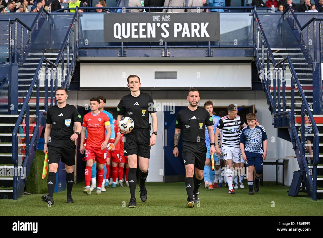 Glasgow, Scotland, UK. 2nd May, 2025. Referee Ryan Lee leads the teams ...