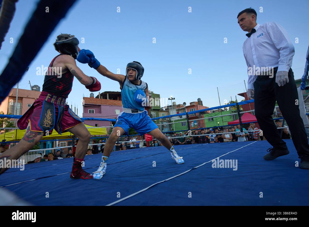 Romero Maximiliano, center, launches a punch to Franco Nicolás Melo ...