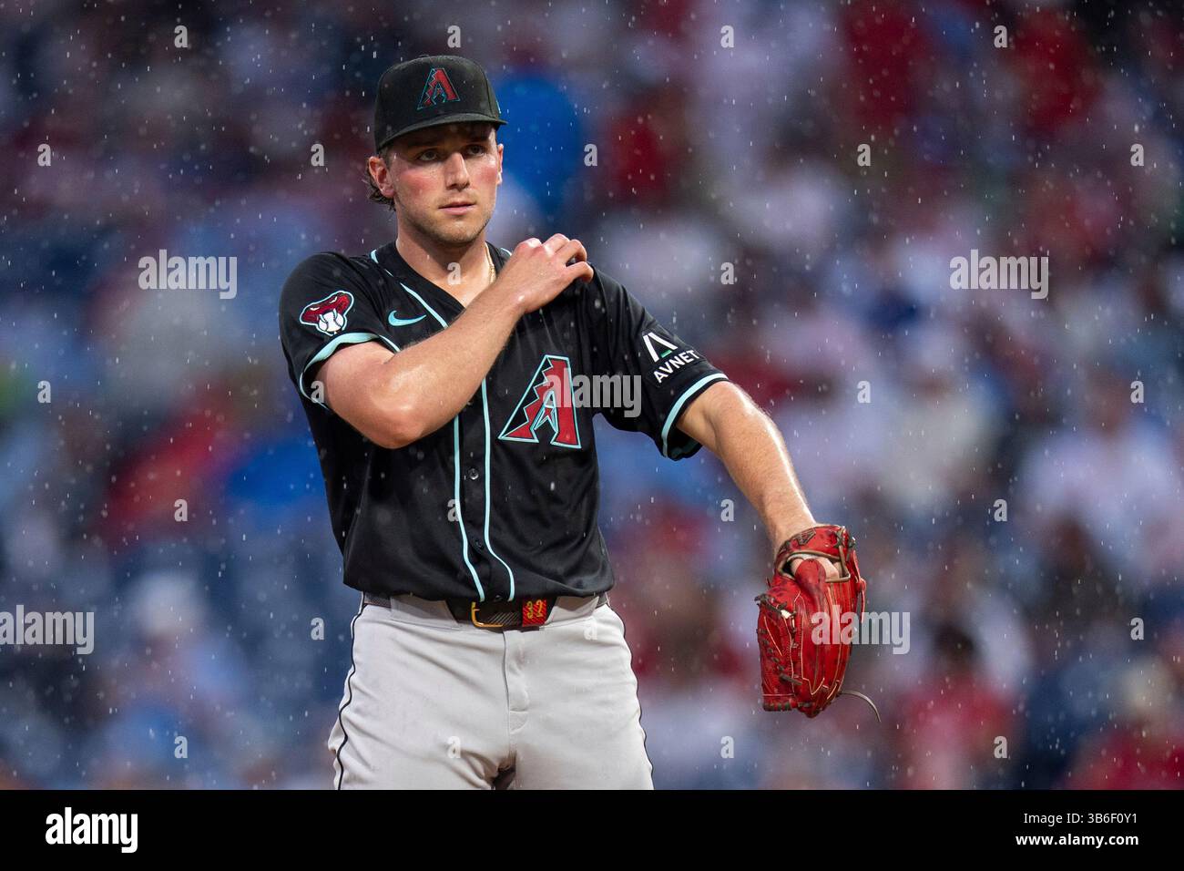 Arizona Diamondbacks starting pitcher Brandon Pfaadt gets ready as rain ...