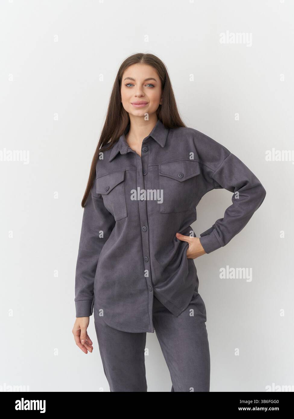 Elegant woman models contemporary fashion in a stylish studio setting ...