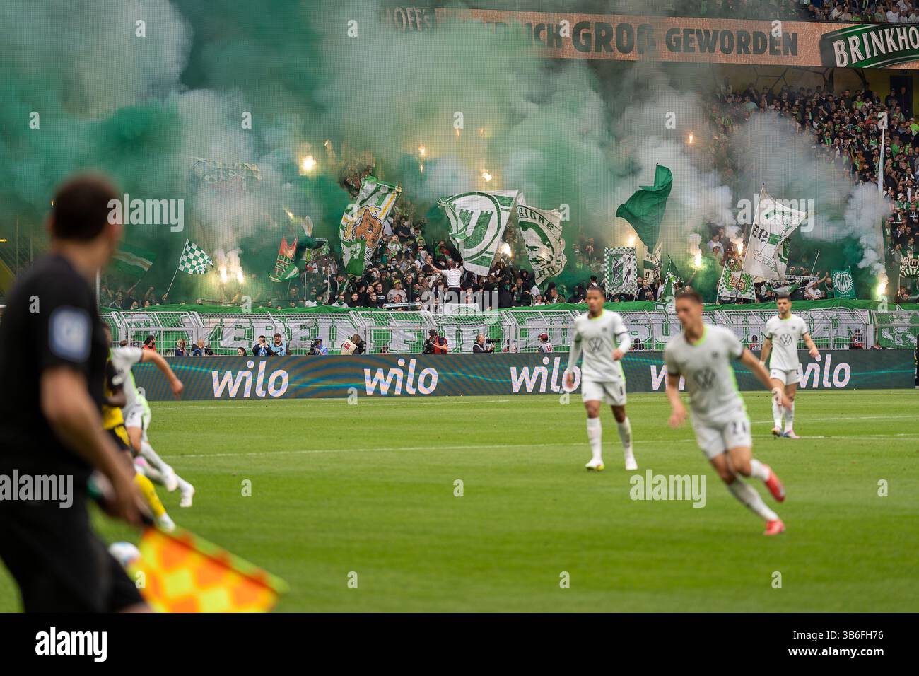 Dortmund, Deutschland. 03rd May, 2025. Wolfsburger Fans zuenden ...