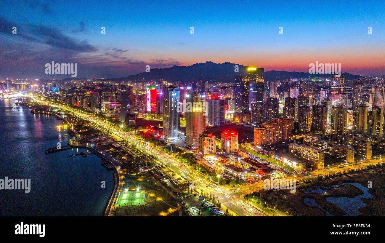 QINGDAO, CHINA - MAY 3, 2025 - Night view of the administrative center ...
