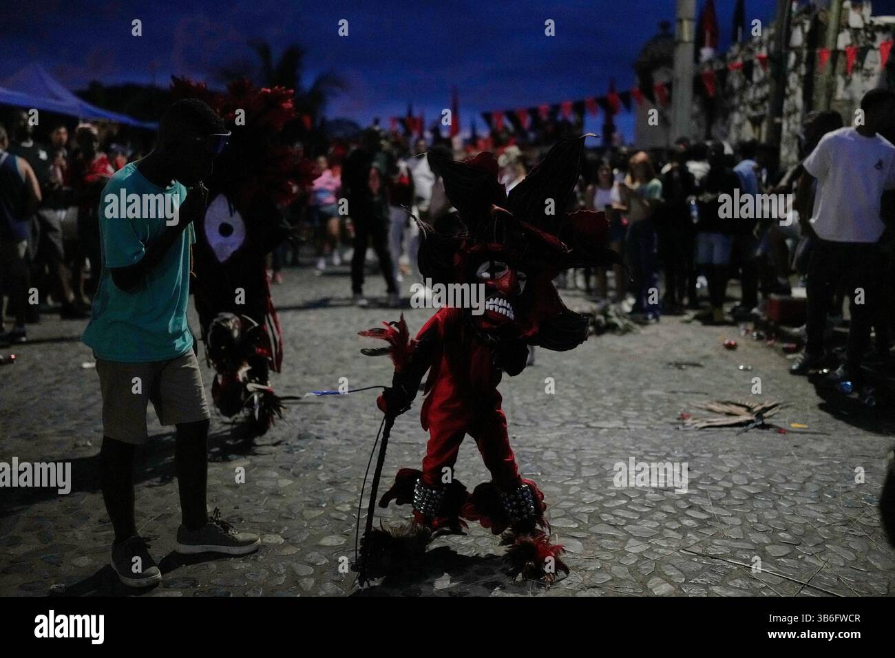 Revelers take part in the Devils and Congos Festival in Portobelo ...