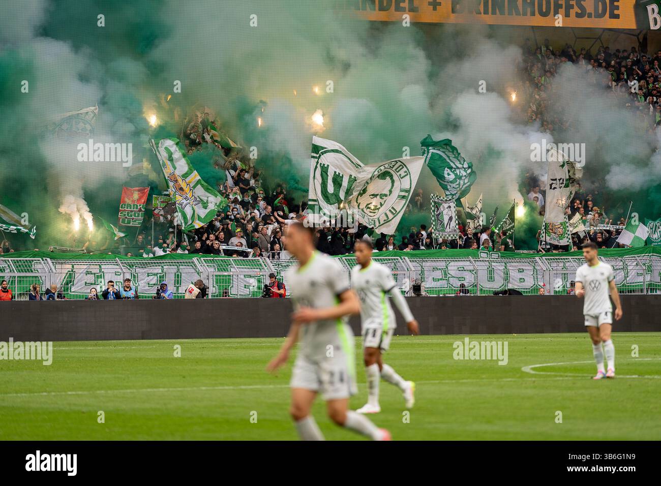 Dortmund, Deutschland. 03rd May, 2025. Wolfsburger Fans zuenden ...