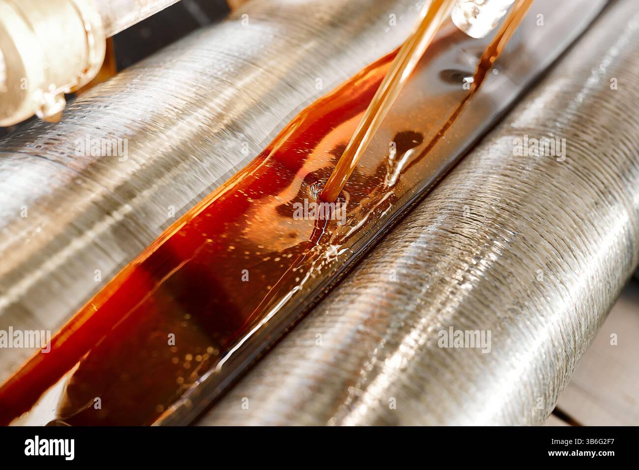 Precision application of adhesive in automated glue-spreading machine ...