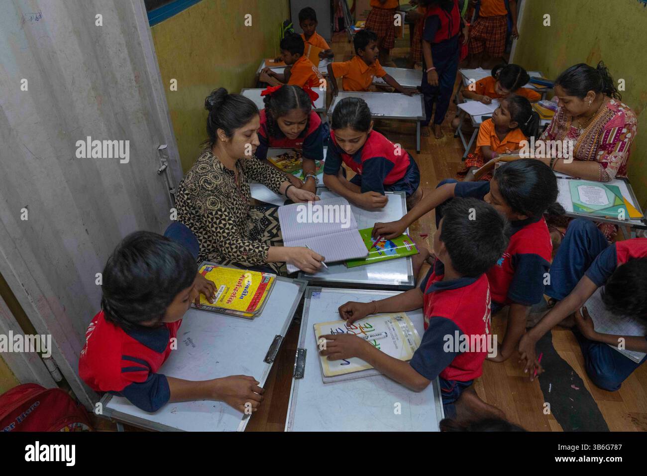 Students attend a Marathi language class at the Signal Shala school in ...