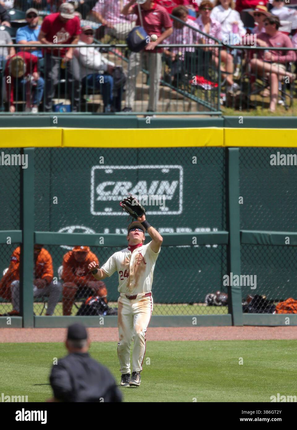 May 3, 2025: Arkansas outfielder Charles Davalan (24) comes in under a ...