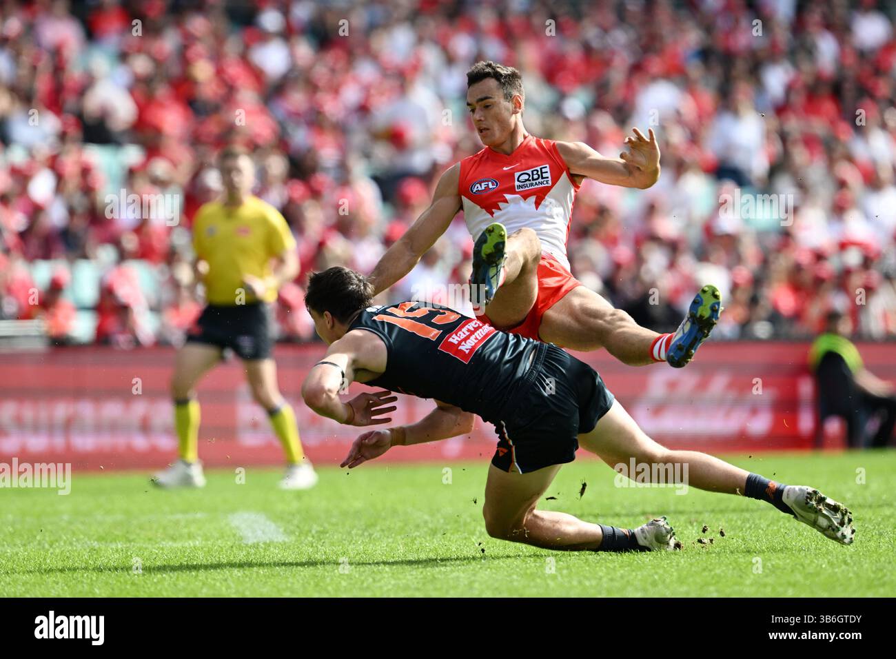 Sydney, Australia. 04th May, 2025. Caiden Cleary of the Swans is hit ...