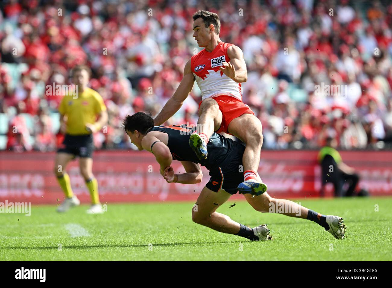 Sydney, Australia. 04th May, 2025. Caiden Cleary of the Swans is hit ...