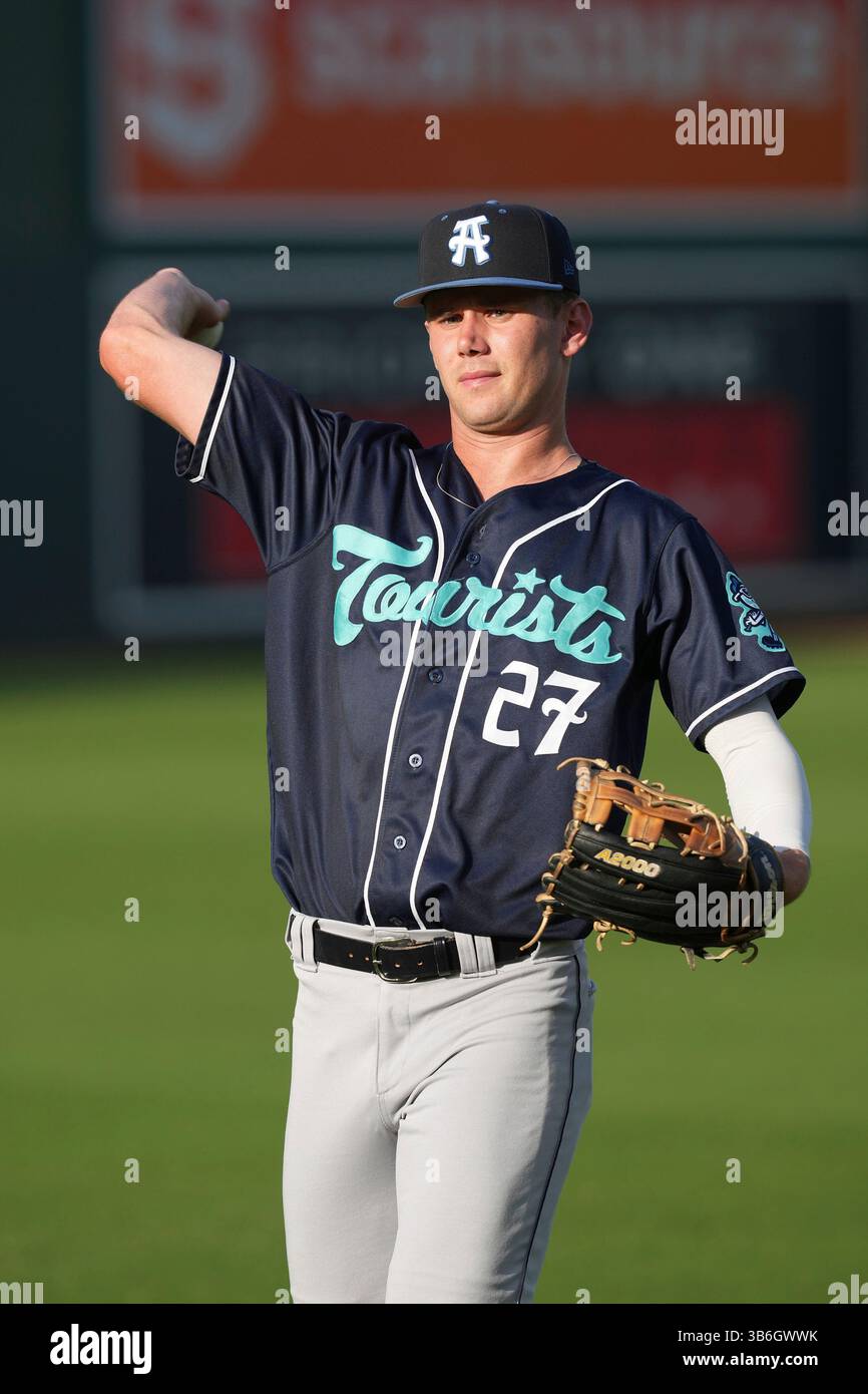 Tyler Whitaker (27) of the Asheville Tourists warms up before a South ...